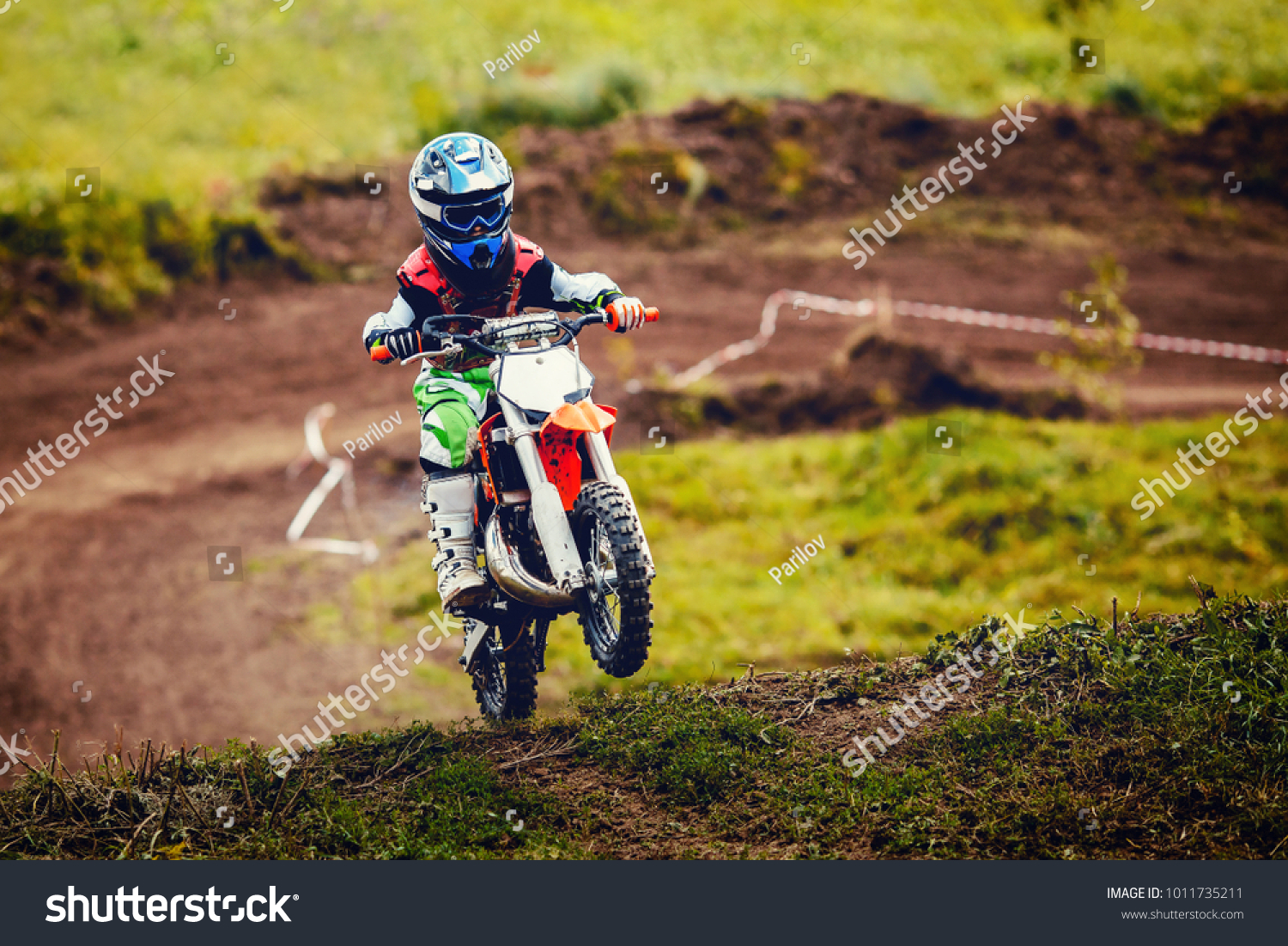 Racer child on motorcycle participates in motocross cross-country in ...