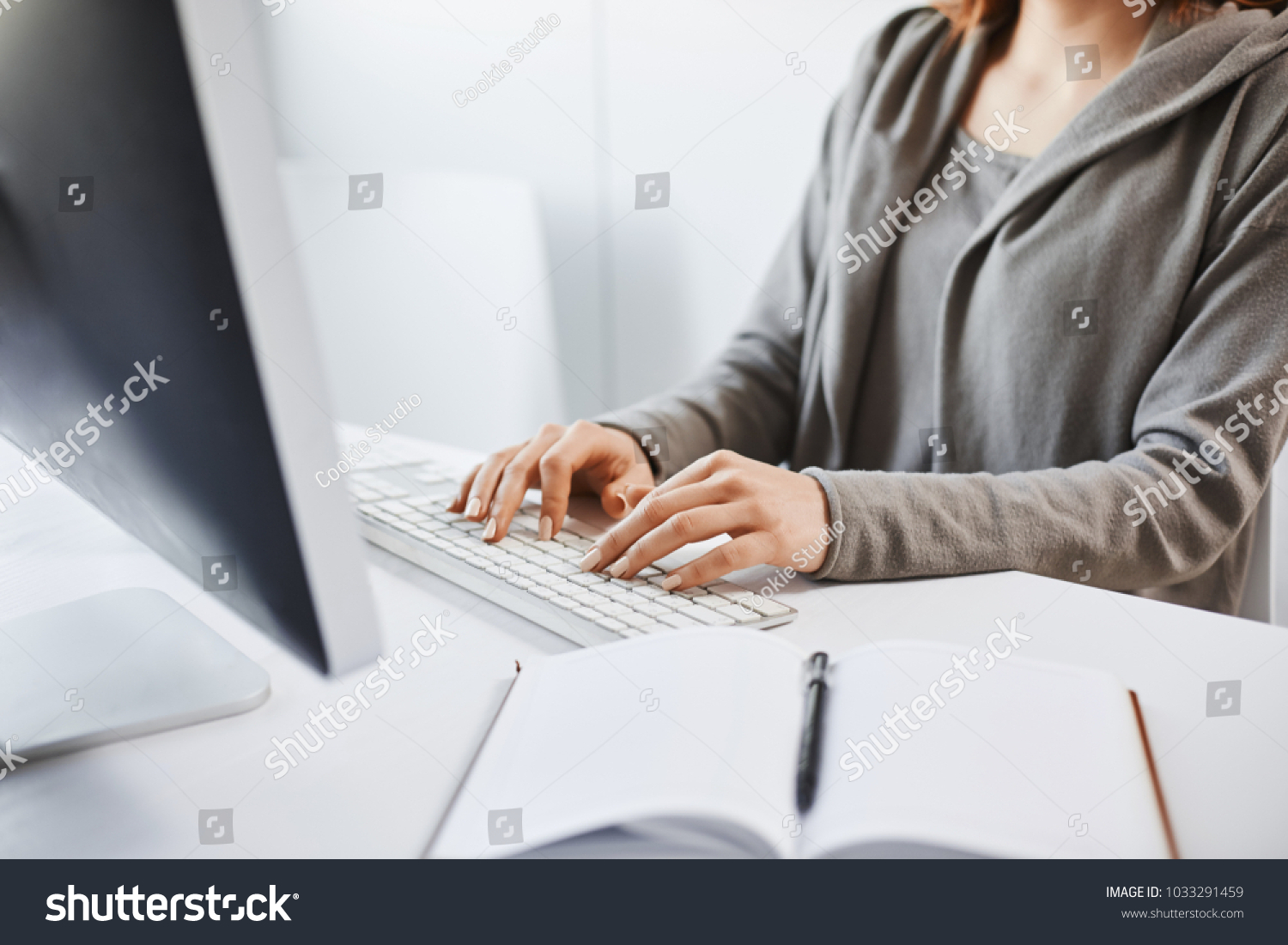 Working hard to party hard on weekends. Cropped shot of woman typing on ...