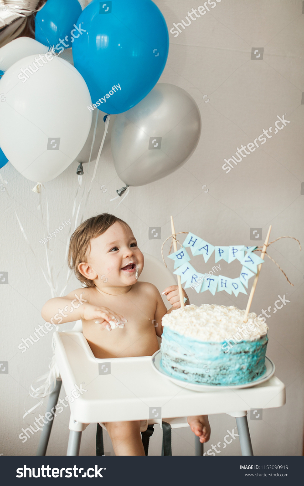 First Happy birthday. Child in the day of birth one year. Curious baby ...