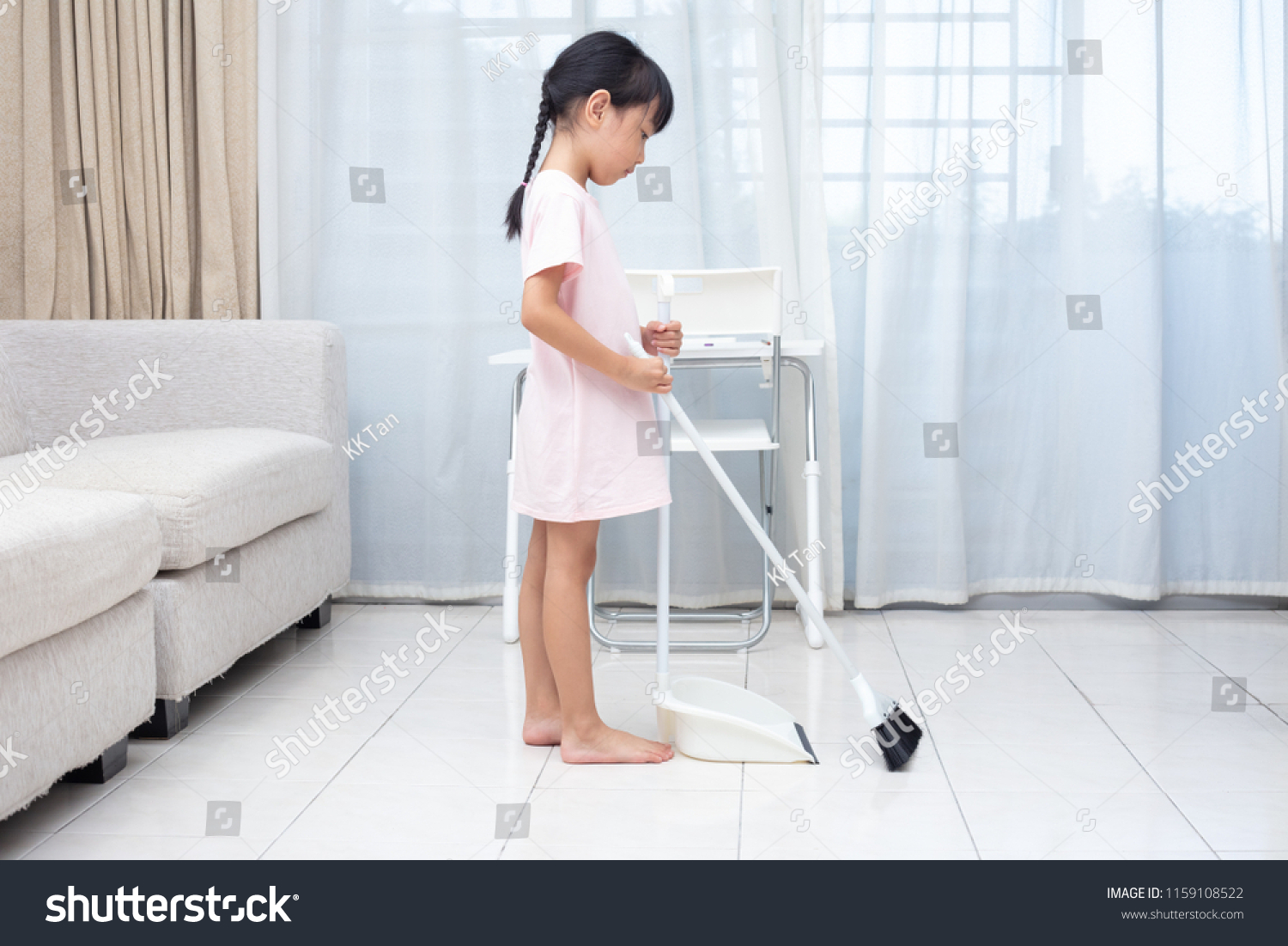 Asian Chinese little girl helping doing cleaning with broom and dustpan ...