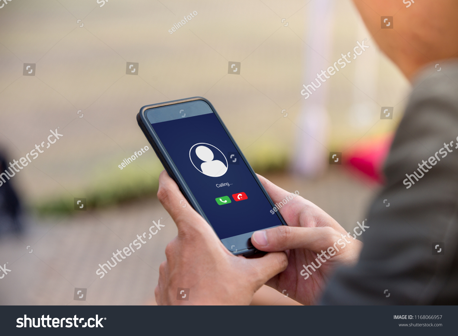 Voice call concept on the screen. Man holding smartphone doing voice ...