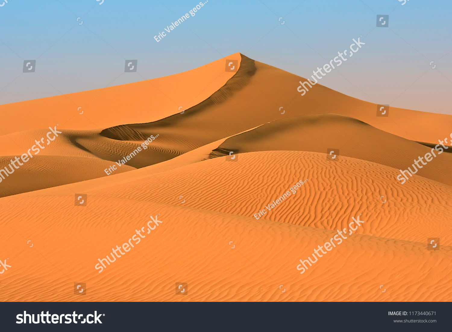 Beautiful sand dunes of the Morrocan desert with blue sky Morocco ...