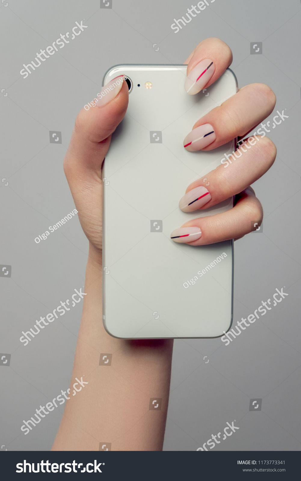 Phone in hand. Nails Design. Hands With with a matt minimalist manicure ...
