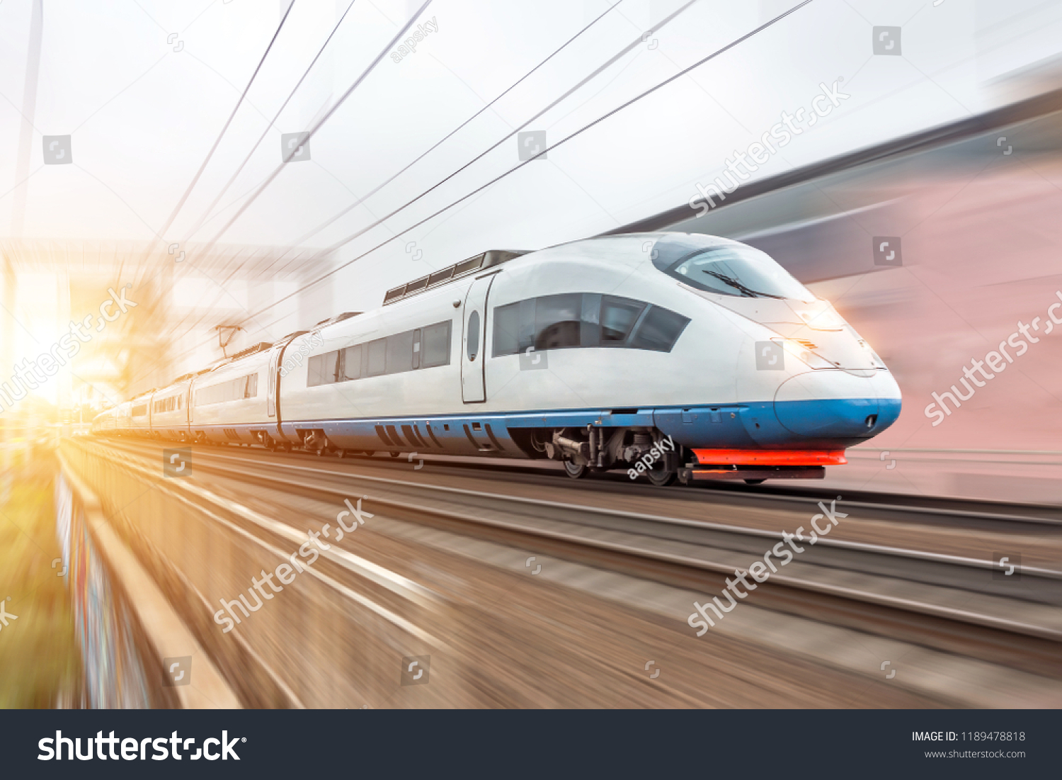 High speed fast train passenger locomotive in motion at the railway ...