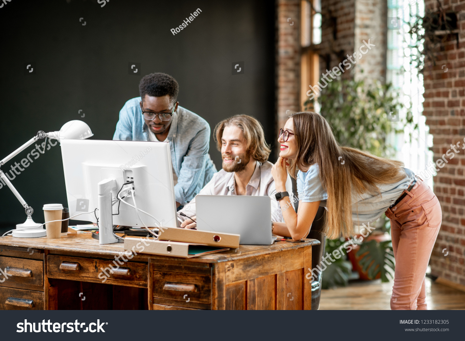 Group of young multi ethnicity coworkers dressed casually working ...