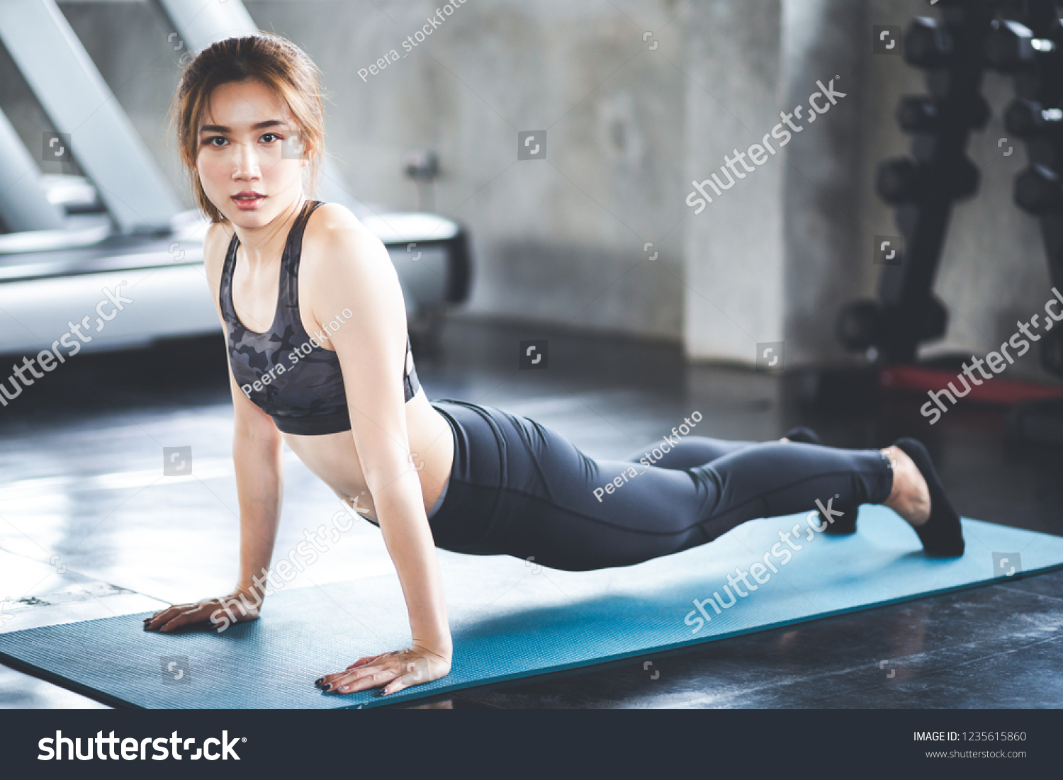 Fitness asian woman doing yoga exercise and relax with sportswear in sport gym healthy lifestyle ...