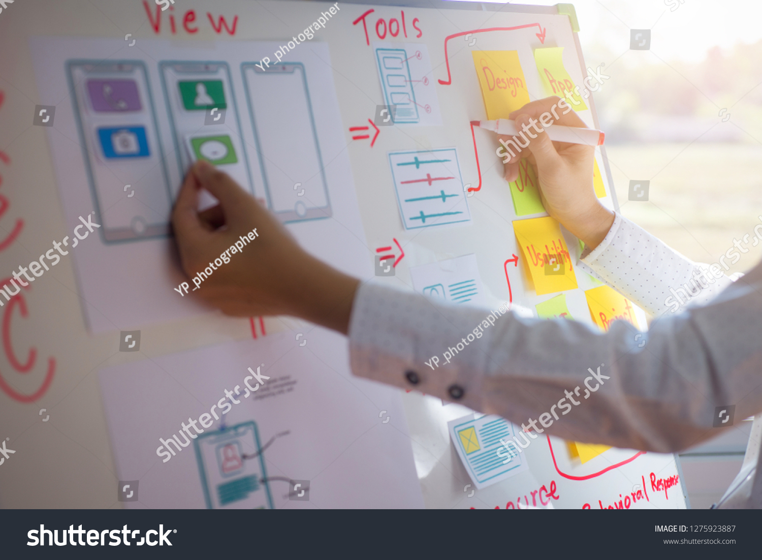 Closeup hand of designer woman sort layout of drawing application for ...