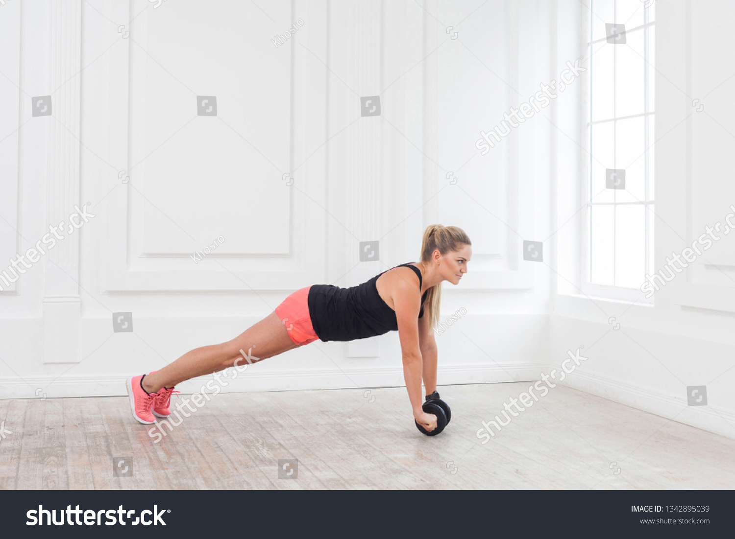 Full length side view portrait of athletic young woman in fit wear ...