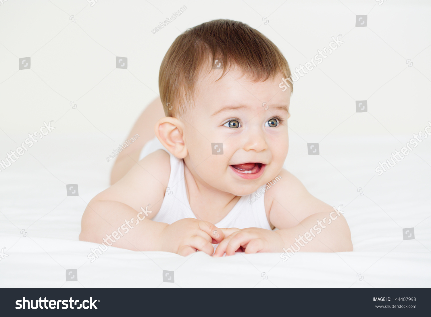 Adorable laughing baby boy showing his first teeth_站酷海洛_正版图片_视频_字体_音乐素材 ...