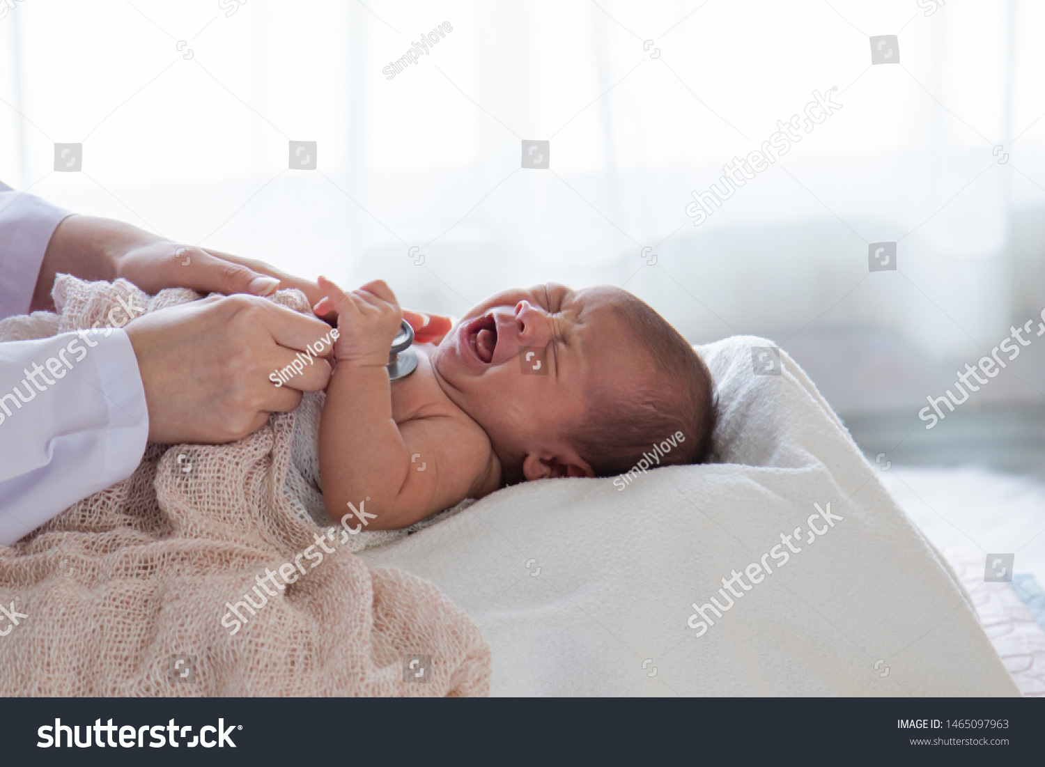 Asian newborn baby get sick crying during examine by pediatrician ...