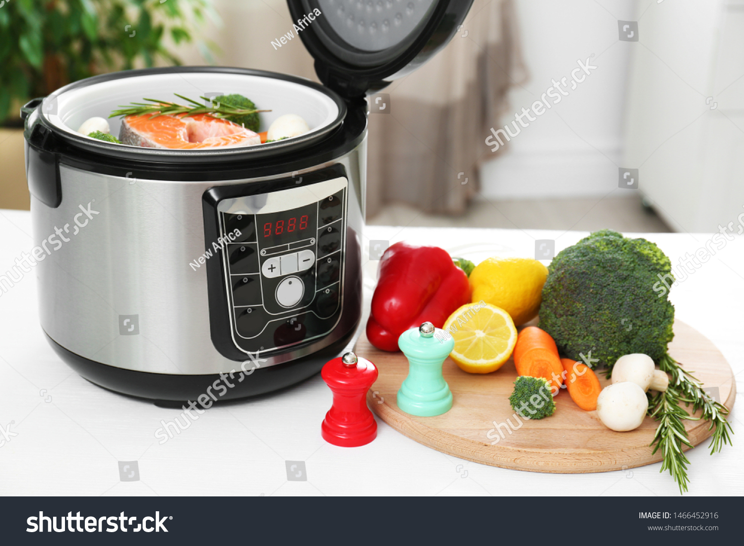 Modern multi cooker and products on kitchen table_站酷海洛_正版图片_视频_字体_音乐素材 ...