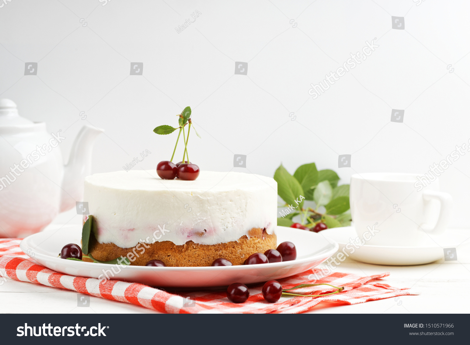 Homemade cherry pie with delicate yogurt filling and cup of tea on white wooden table_站酷海洛_正版图片 ...