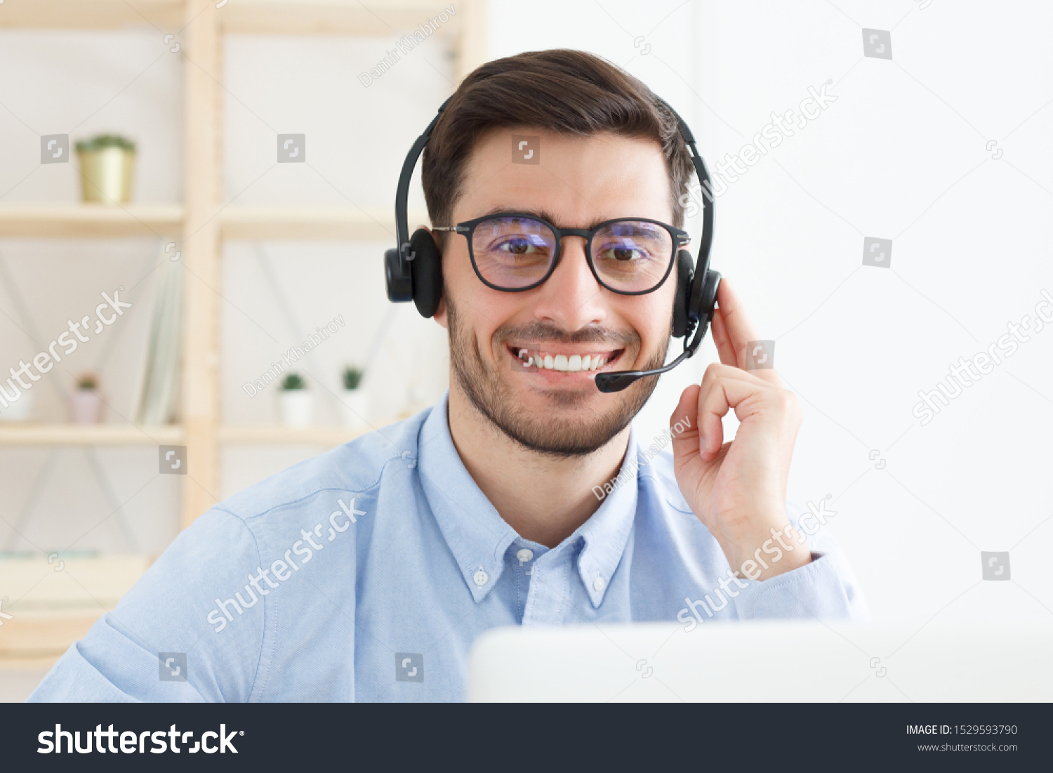 Customer service. Close-up portrait of young male technical support in ...