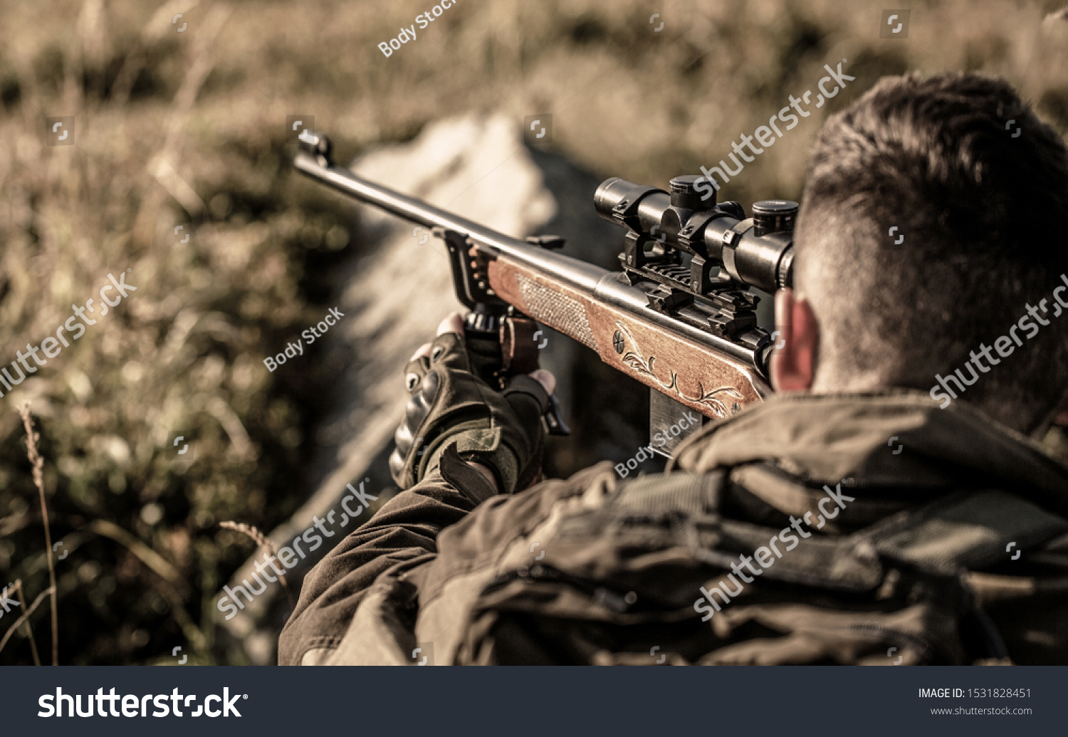 The man is on the hunt. Hunt hunting rifle. Hunter man. Hunter with ...