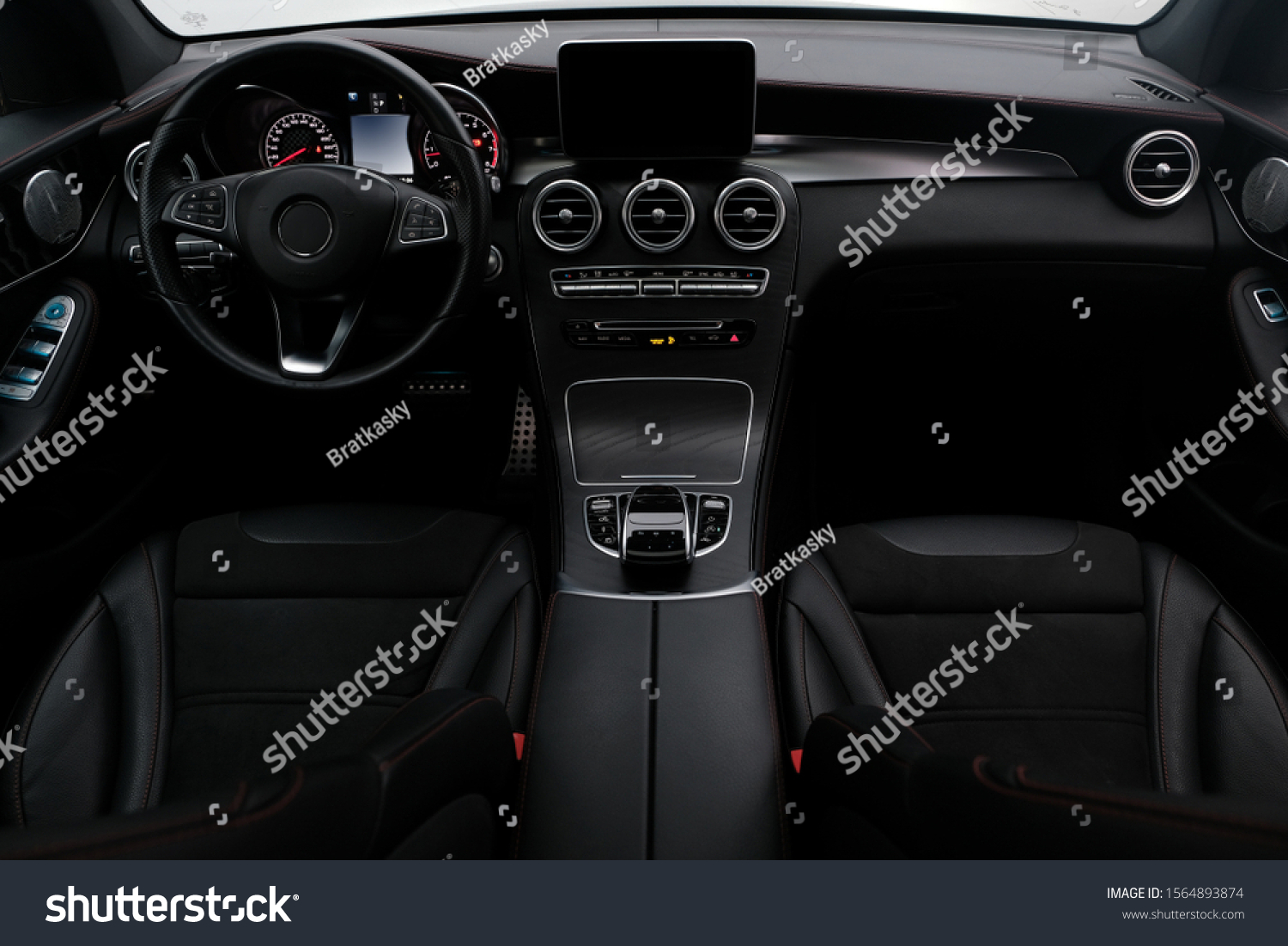 The interior of a premium car. View of the front control console front ...