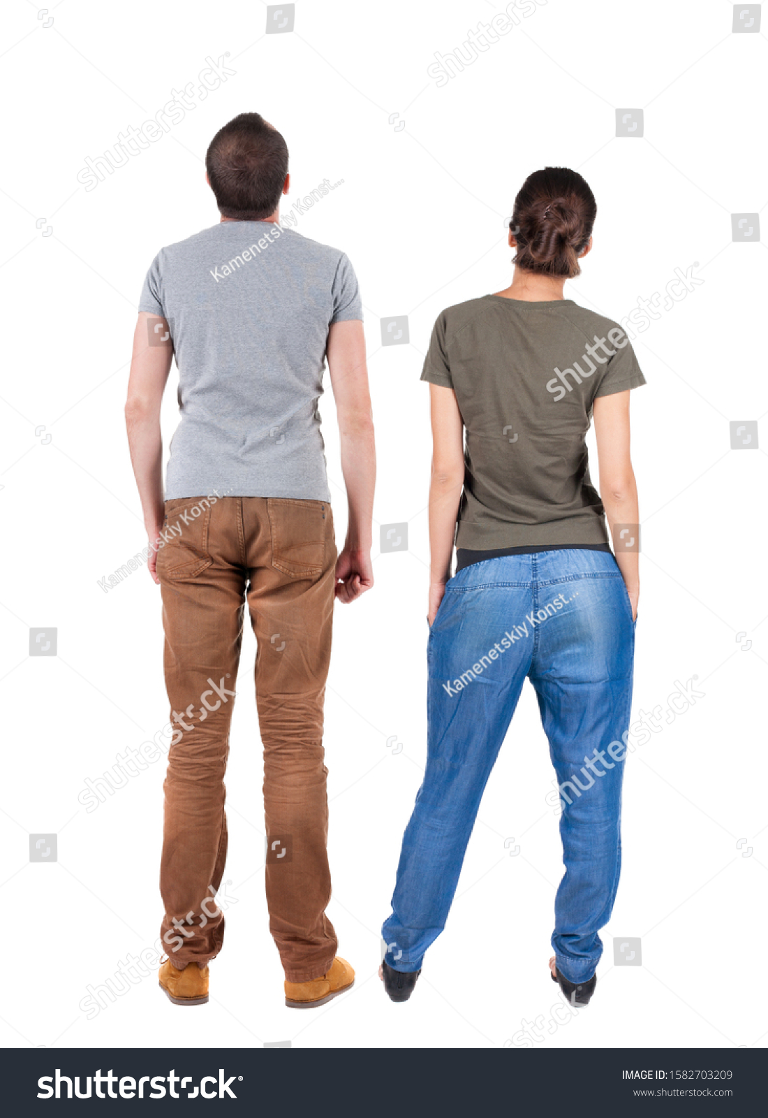 Back view of couple. beautiful friendly girl and guy together. Rear ...