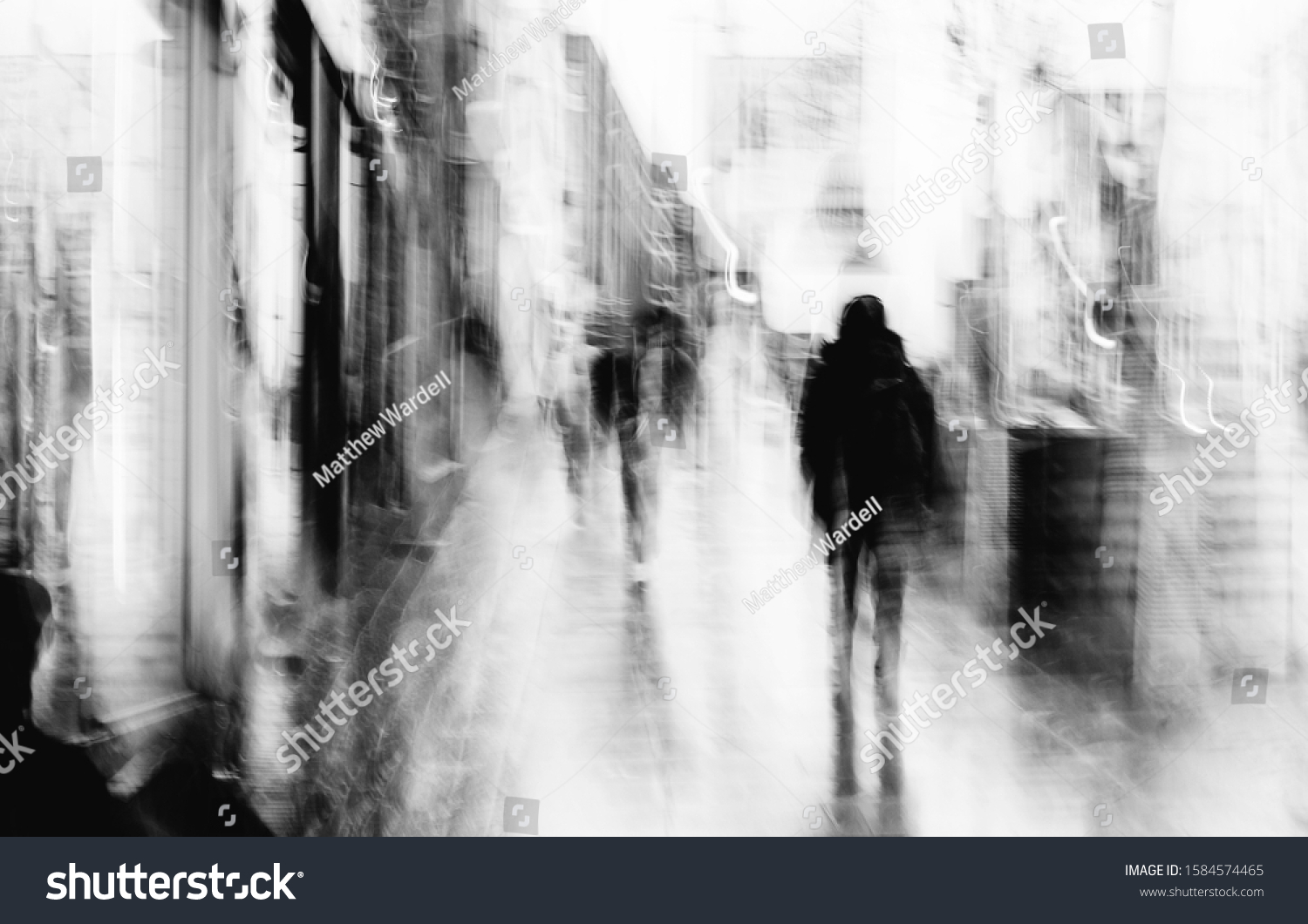Street abstract - long exposure of people on the high street ...