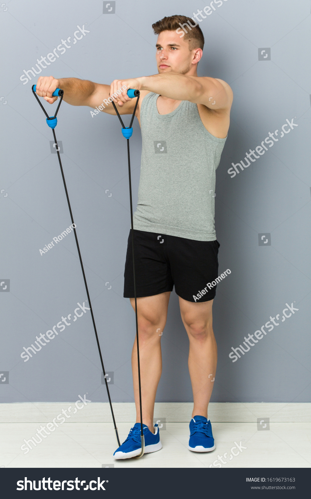 Young fitness caucasian man practicing with an elastic band._站酷海洛_正版图片 ...