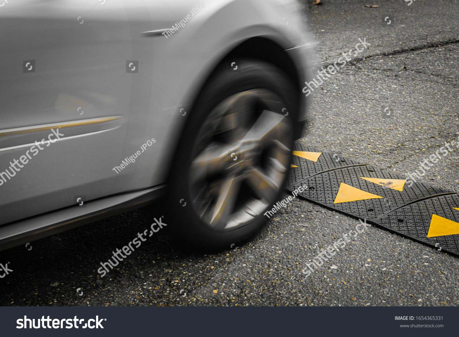 Grey car Driving Up to and Just Connecting with Yellow and Black ...