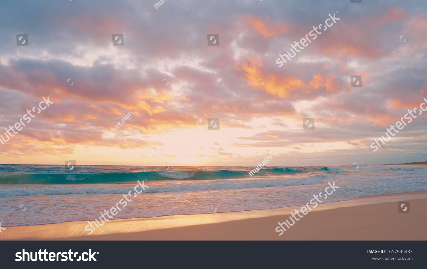 Orange sunset on beach over the sea over Atlantic ocean landscape ...