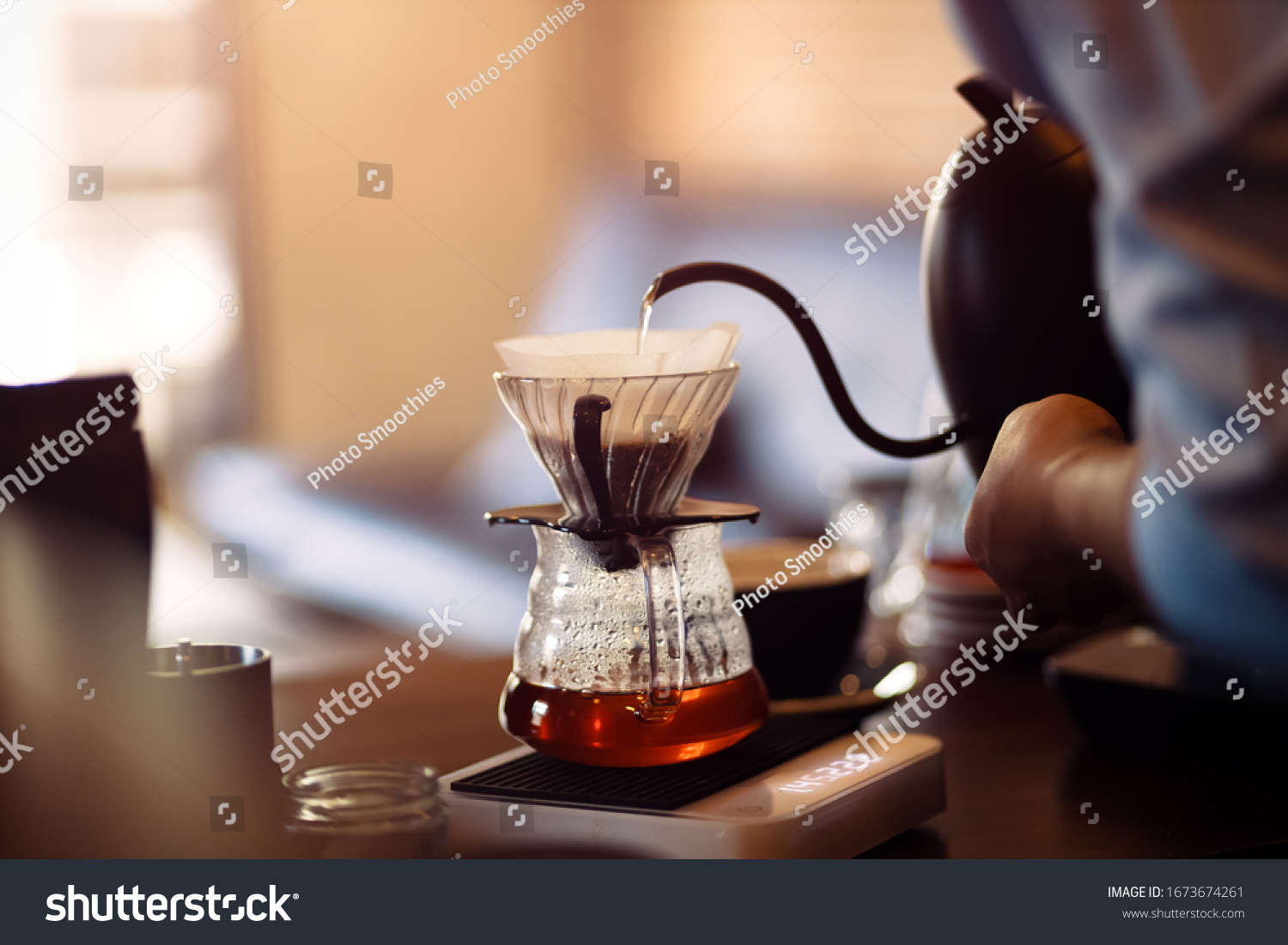 barista pouring boiling water from kettle to drip coffee maker._站酷海洛_正版 ...