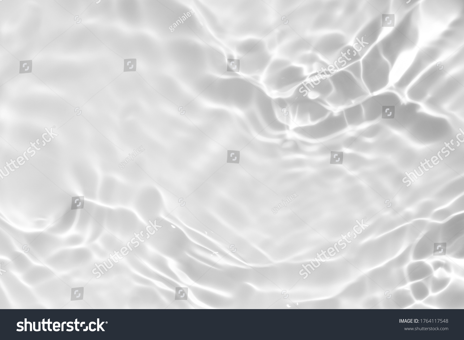 Closeup of desaturated transparent clear calm water surface texture ...