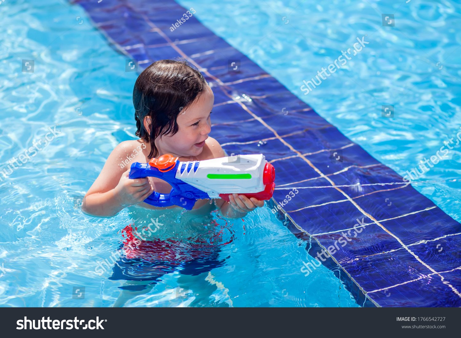 Kid boy playing in the swimming pool. Childhood summer and holiday concept_站酷海洛_正版图片_视频_字体_音乐素材 ...