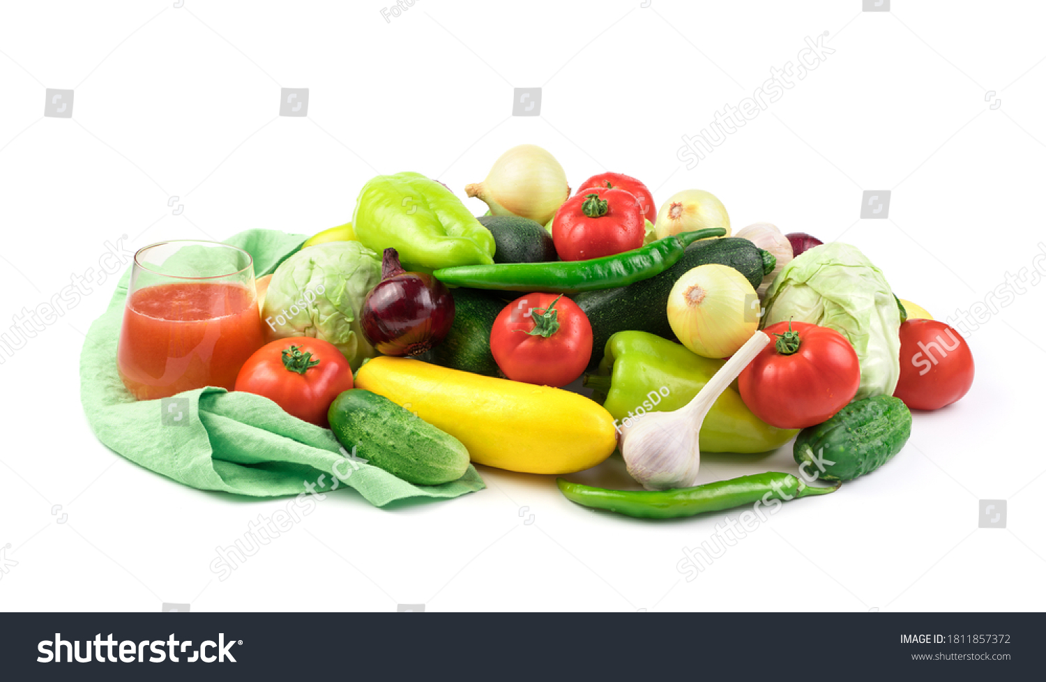 Composition of ripe fresh vegetables and a glass of vegetable juice on ...