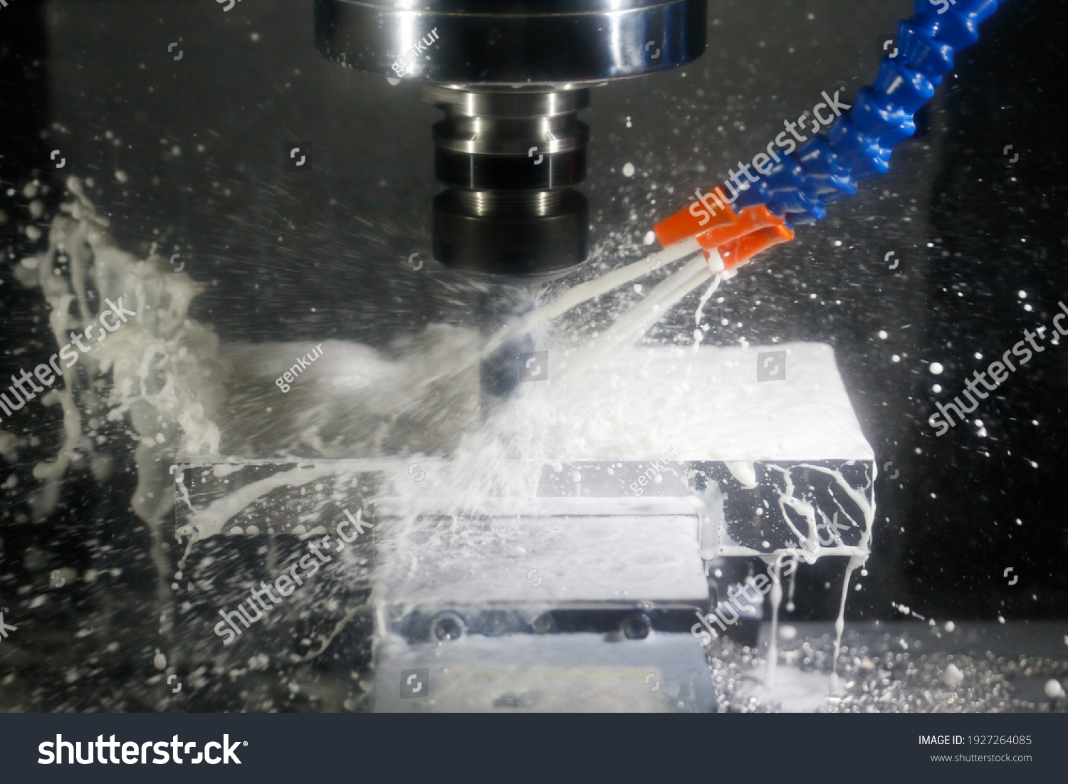 Milling process with coolant on a CNC machine. Milling process of ...