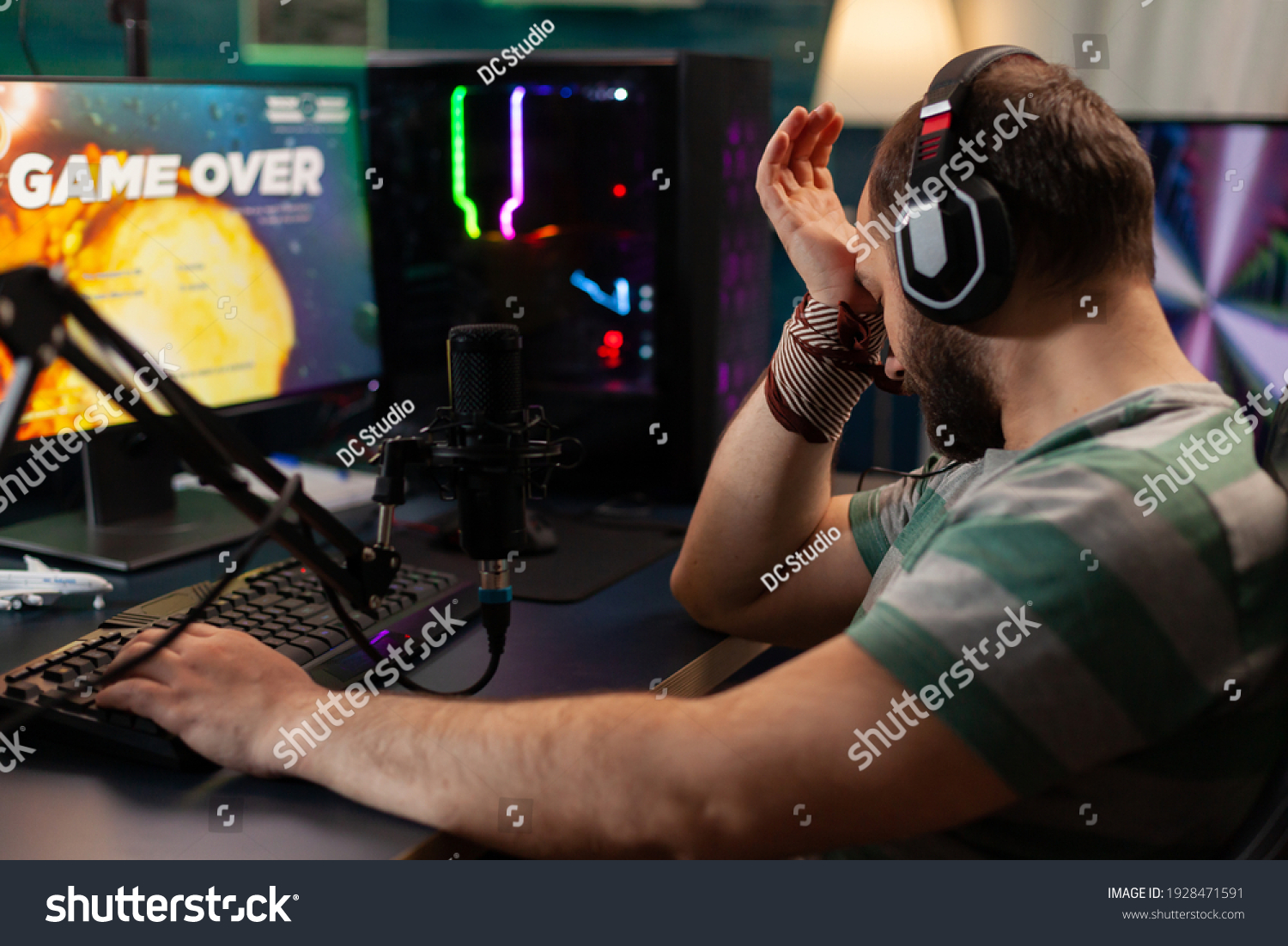 Back shot of disappointed esport streamer losing virtual competition ...