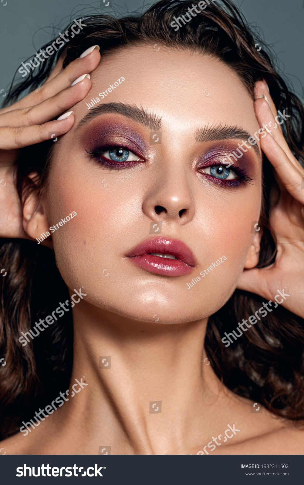 Close-up portrait of a beautiful woman with evening makeup. Strong skin ...