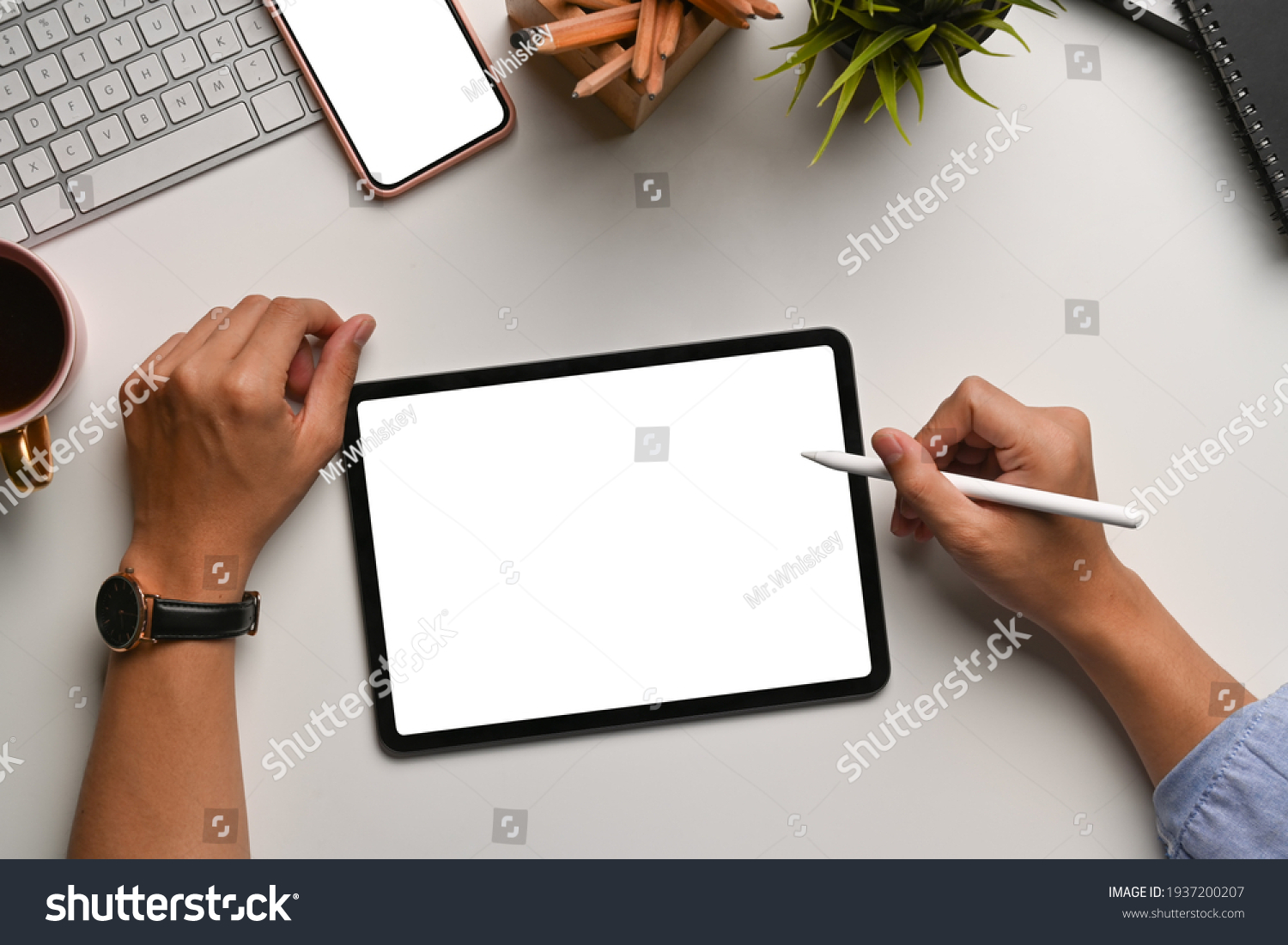 Overhead shot of businessman holding stylus pen writing on screen of ...