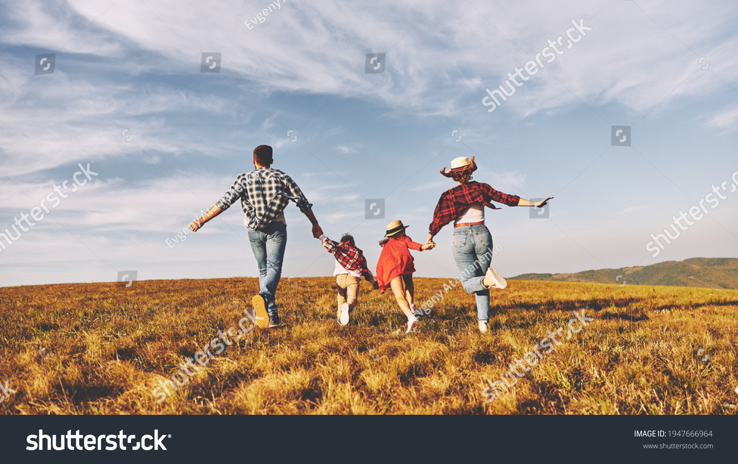 Back view of happy family: mother father children son and daughter ...