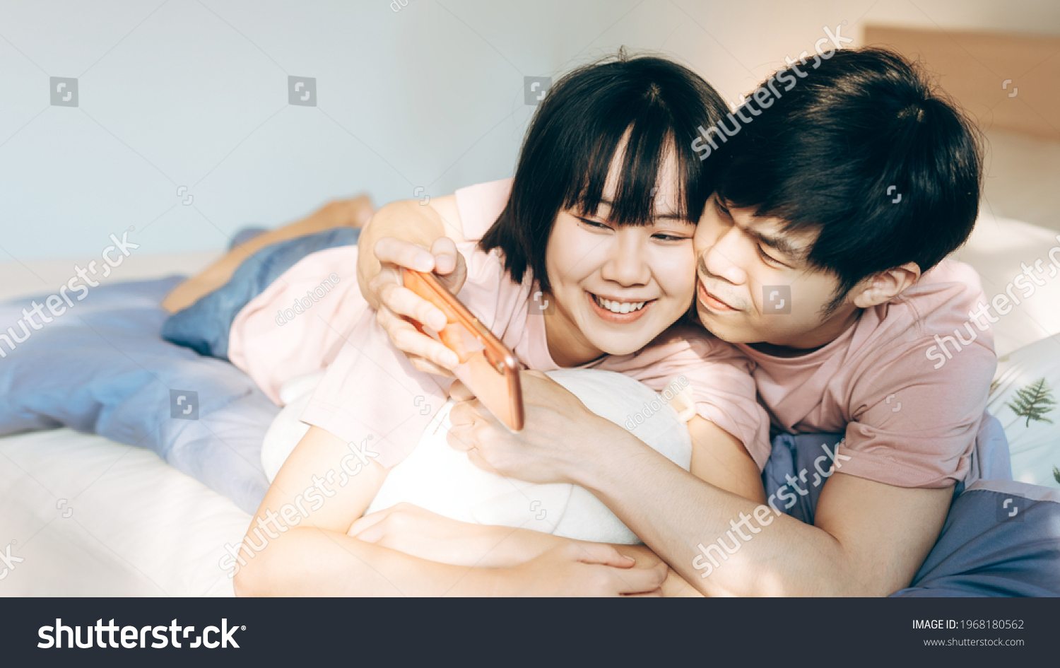 Young adult asian lover couple together living at home concept. Happy smile people in bedroom ...