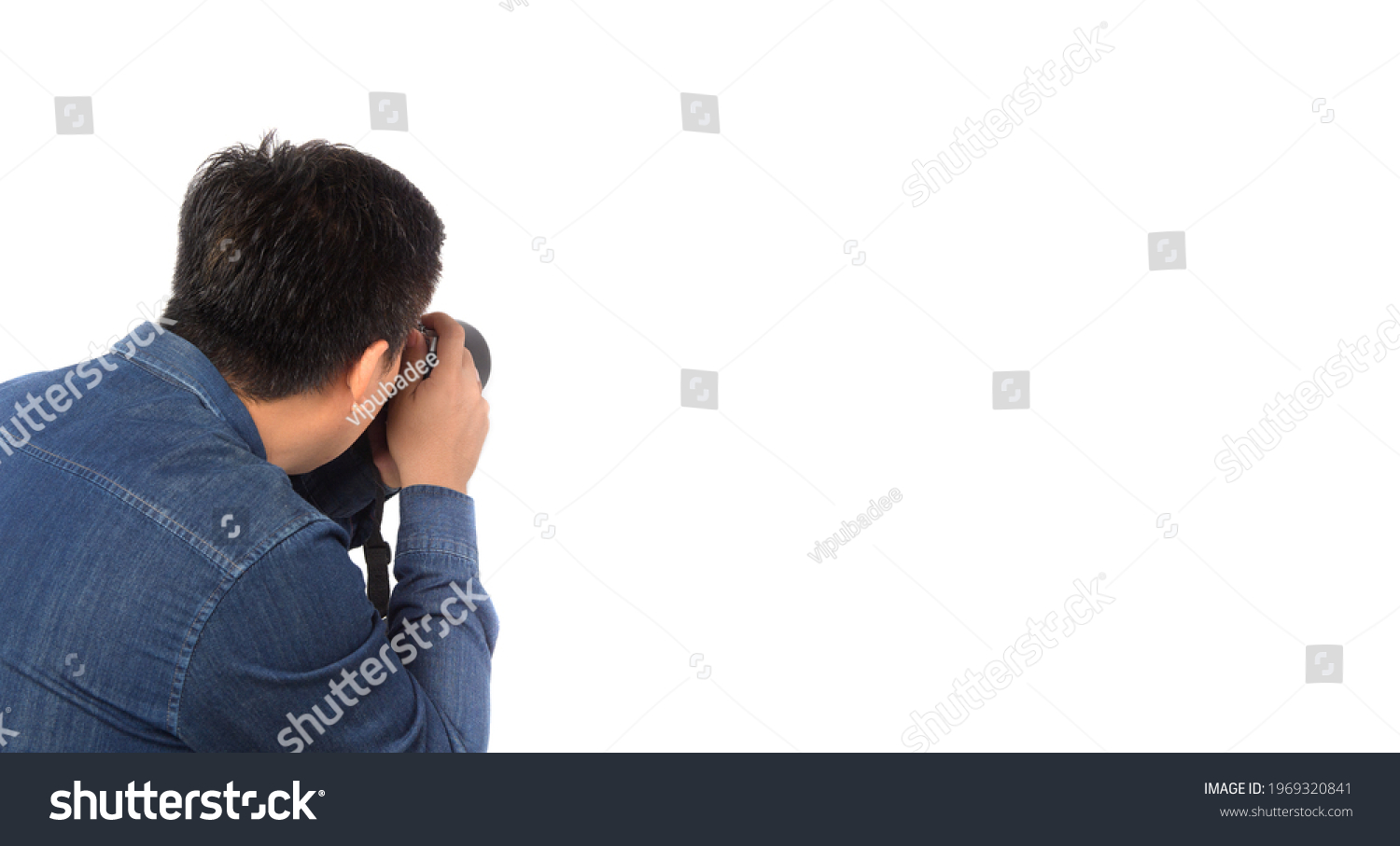 Back view professional photographer holding camera working. Photography ...