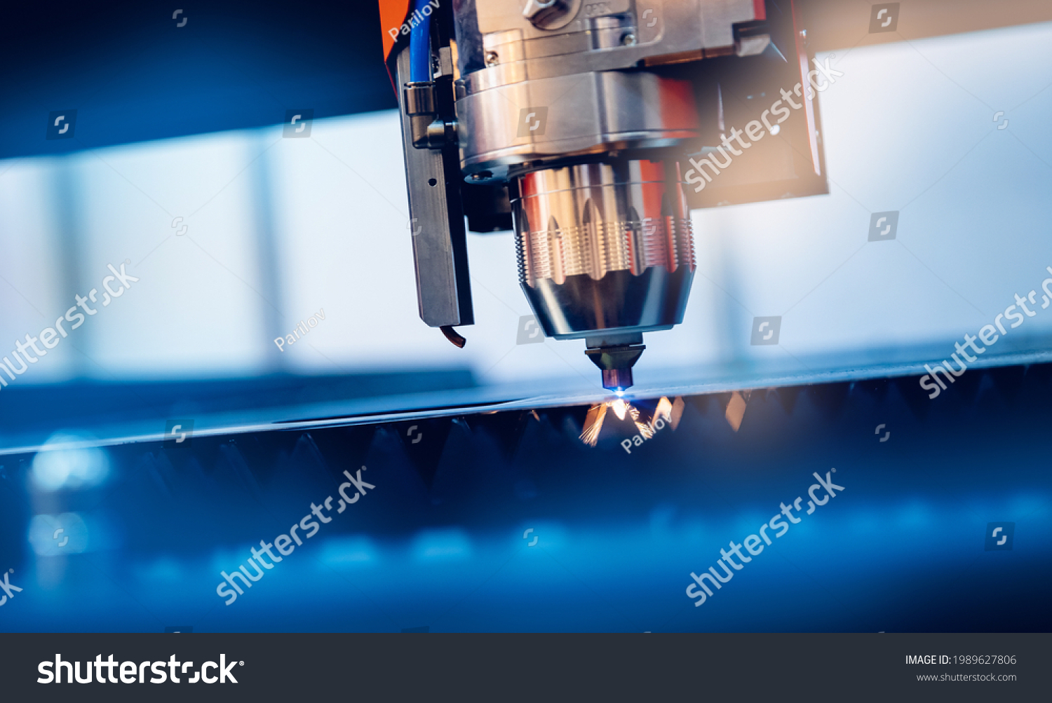 Industrial background CNC laser machine cutting sheet metal with light ...