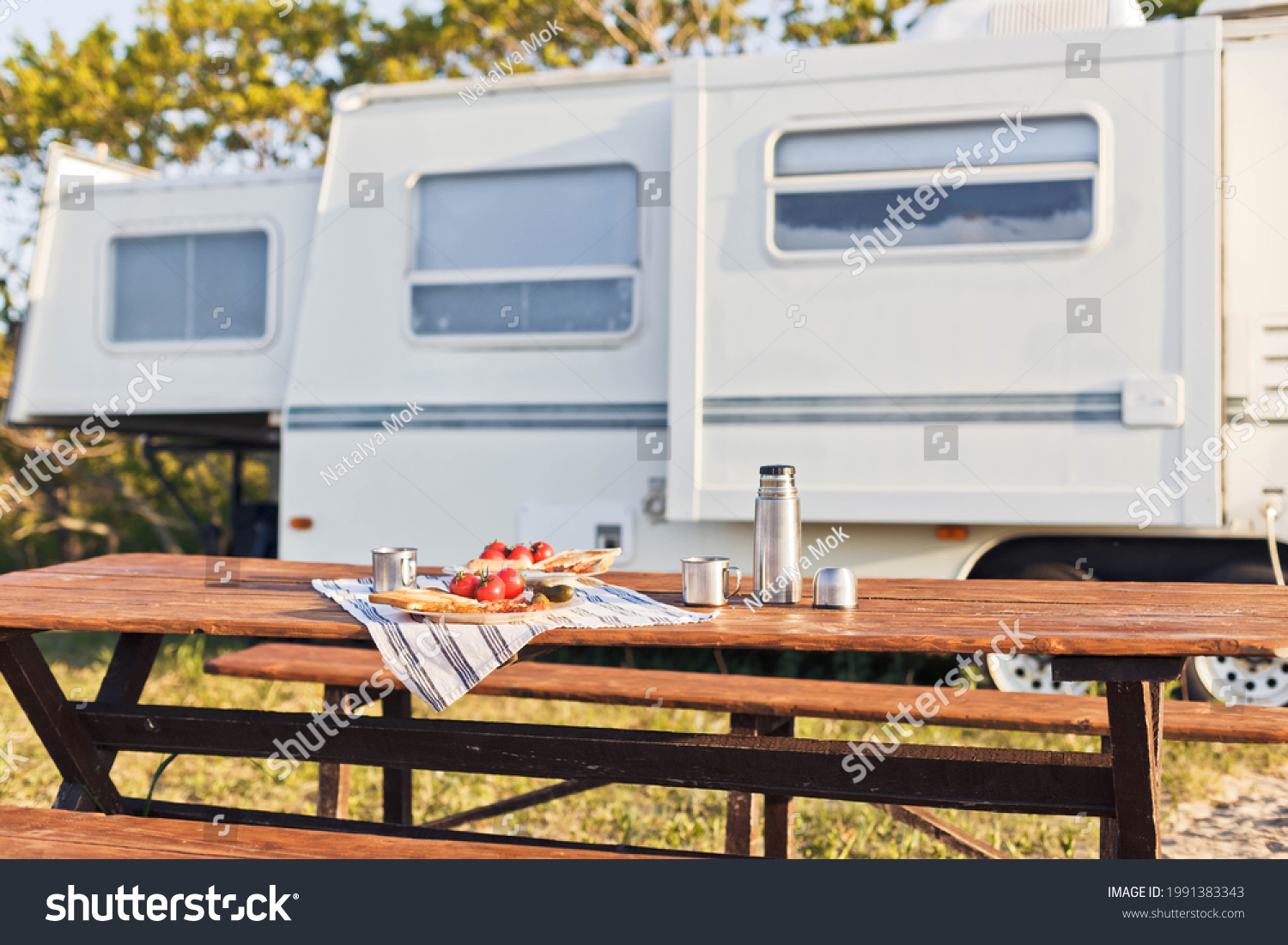 Breakfast near the travel trailer. Breakfast in nature. Fried eggs with ...