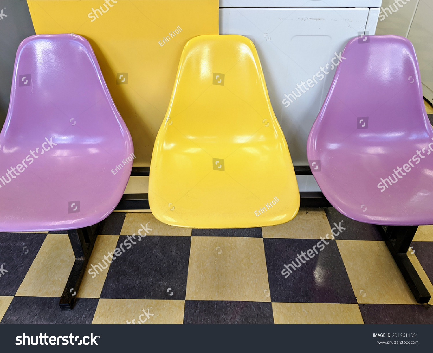 Close up of yellow and purple chairs on checked floor_站酷海洛_正版图片_视频_字体 ...