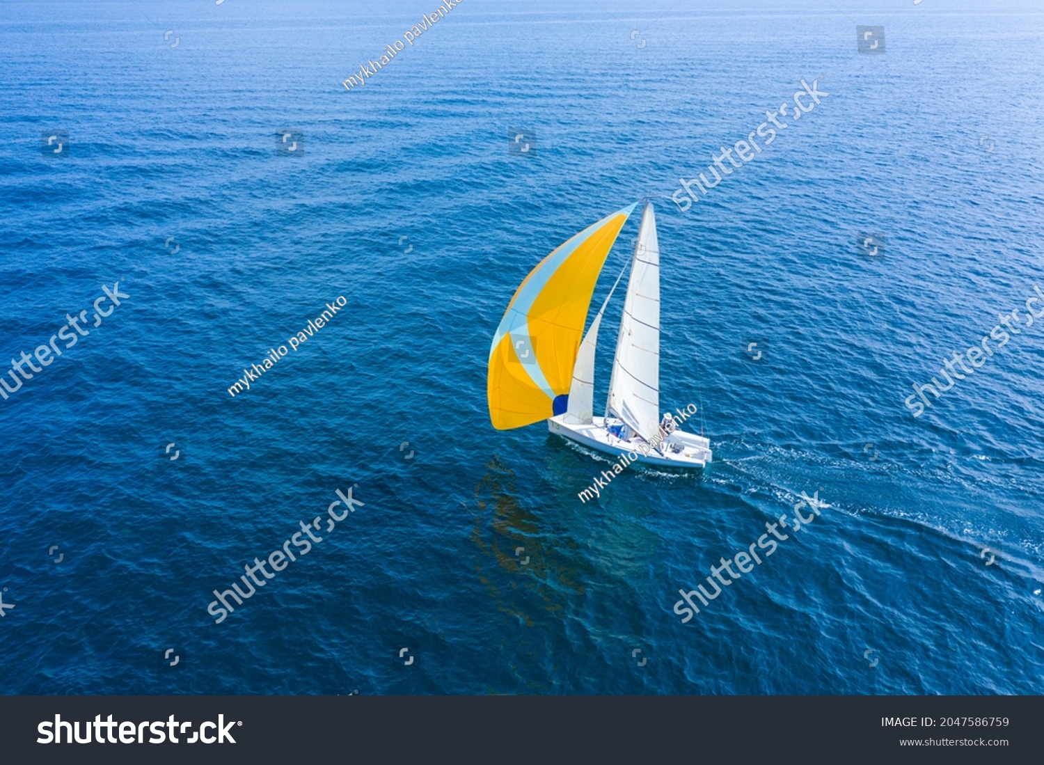 Summer vacation on the water. Aerial view of a beautiful white sailing ...