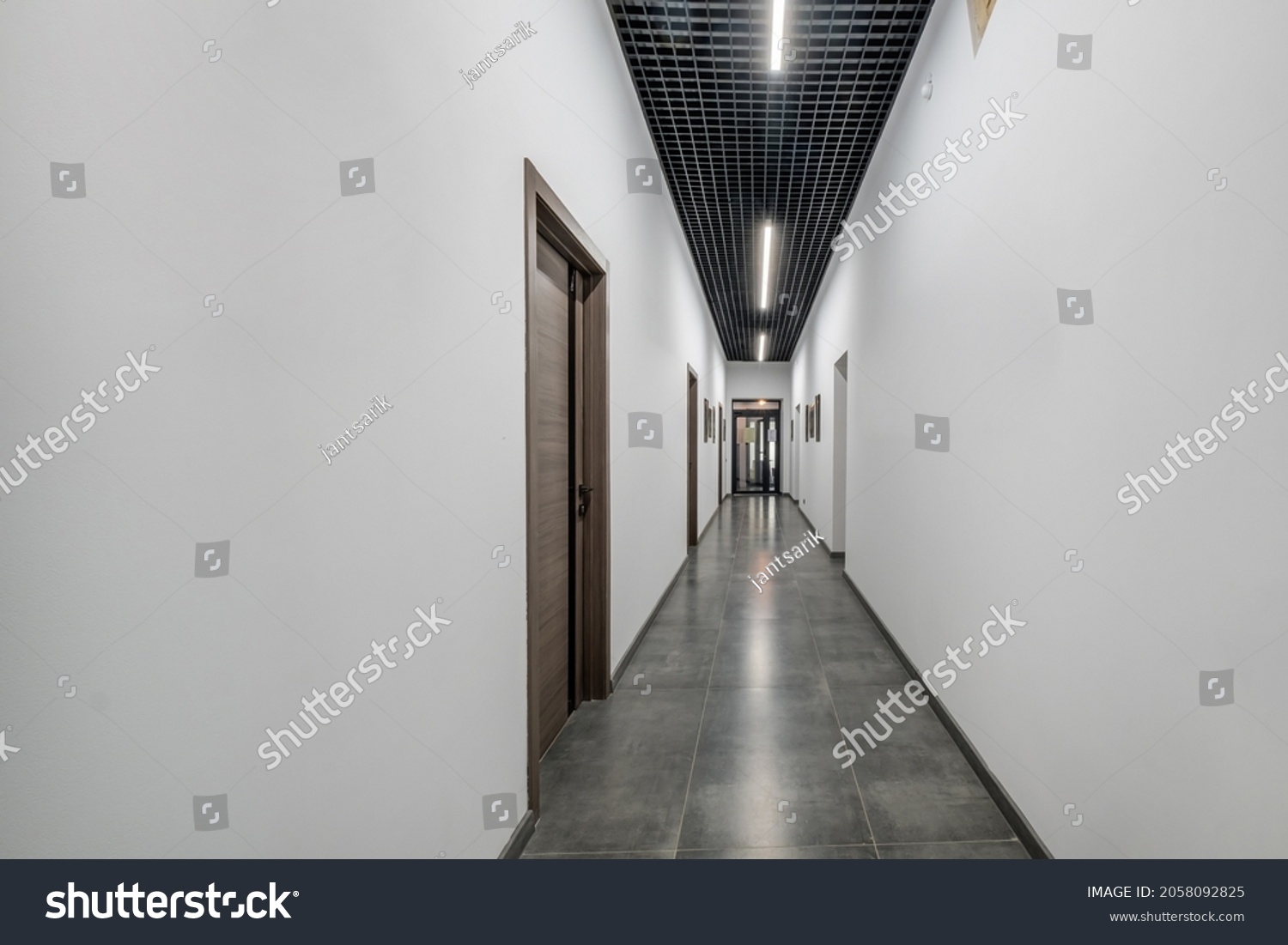 long white empty corridor in interior of entrance hall of modern ...