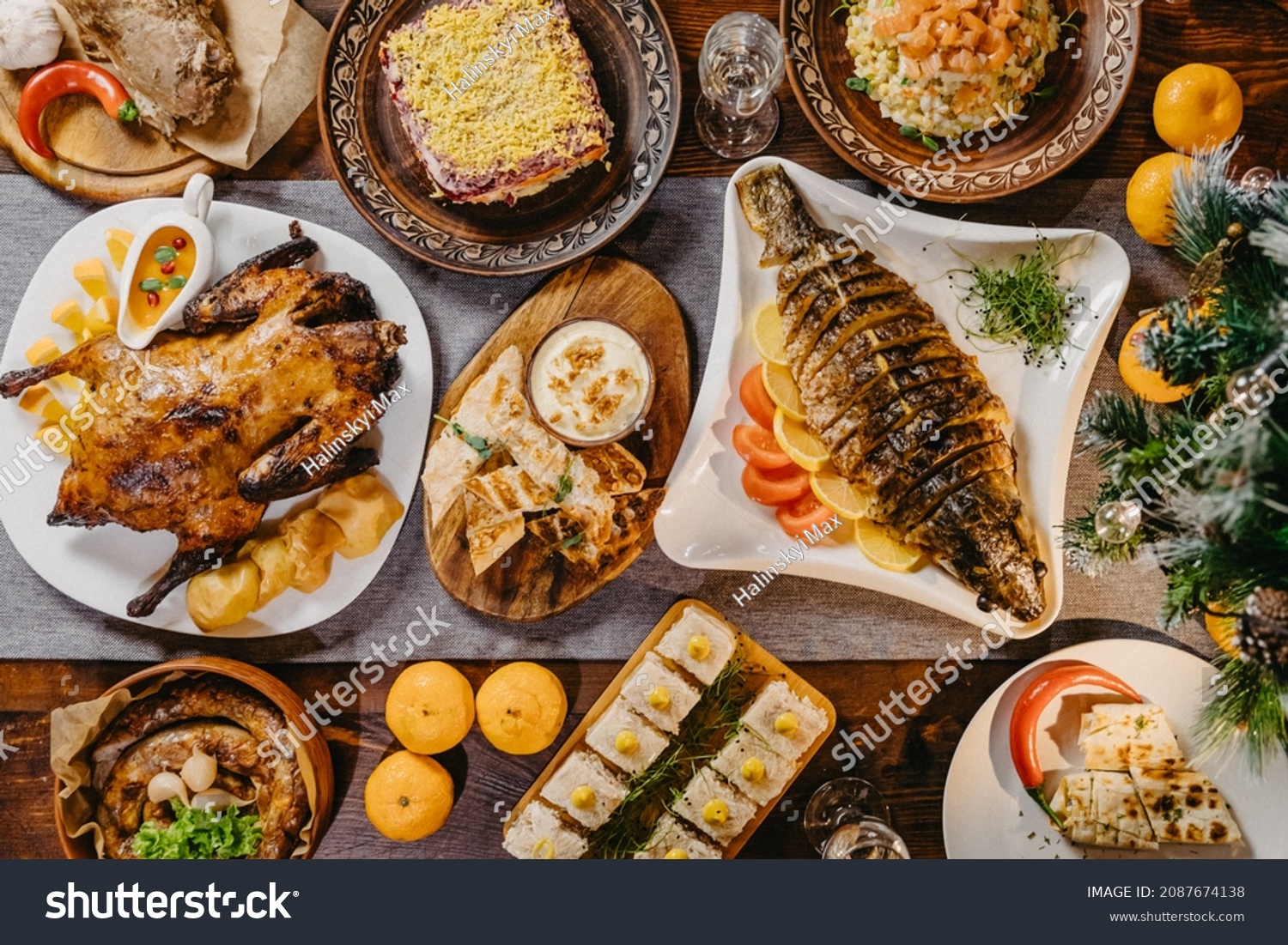 large and generously covered with delicious dishes table on which there ...