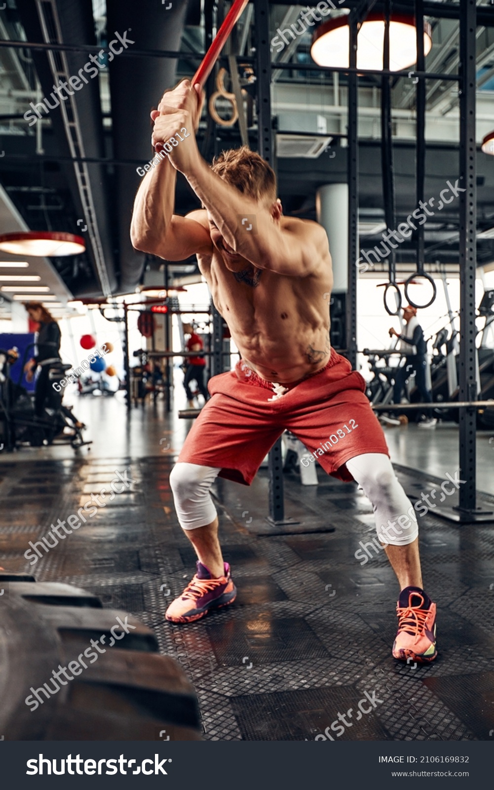 Strength concept. Male athlete using hammer during fitness workout ...