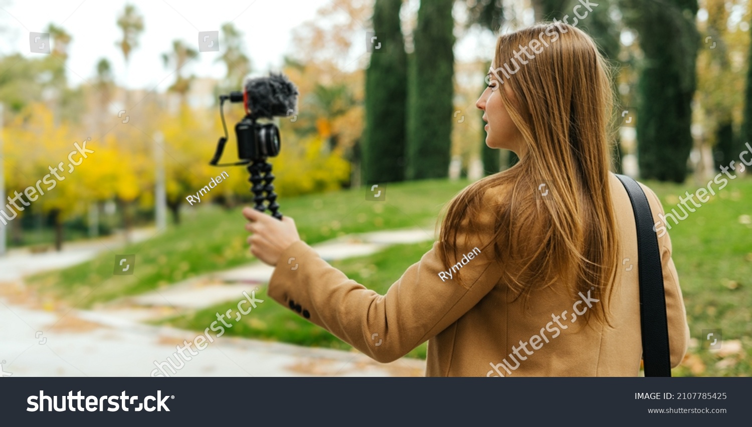 Young woman taking video for vlog. Female blogger influencer recording ...