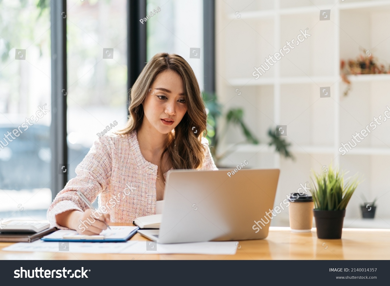 Portrait young attractive beautiful asia female sit on desk smile to ...