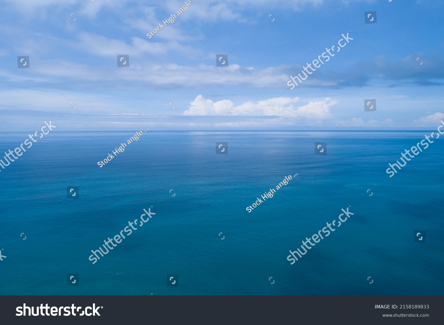 Aerial view of a blue sea surface water texture background and sun ...