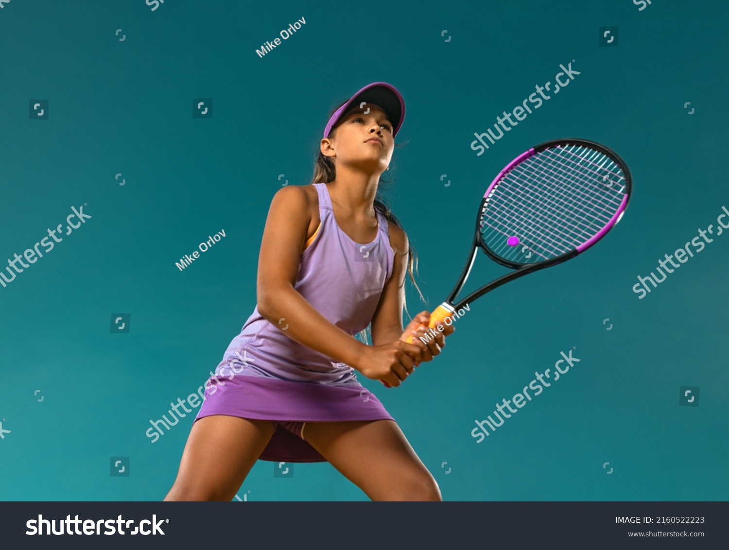 Tennis player. Beautiful girl teenager and athlete with racket in pink ...