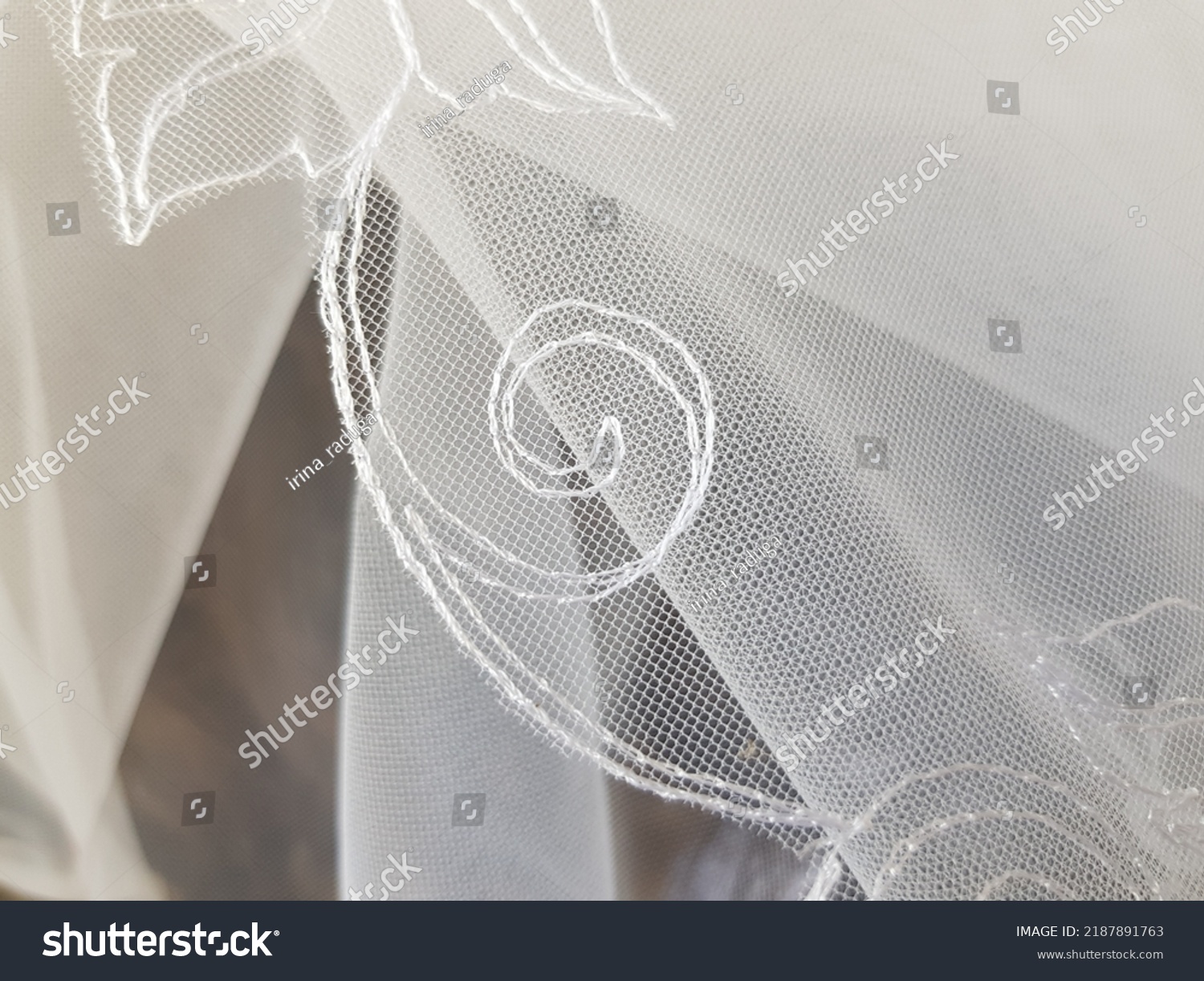 White translucent wedding tulle cape for the bride with an embroidered ...