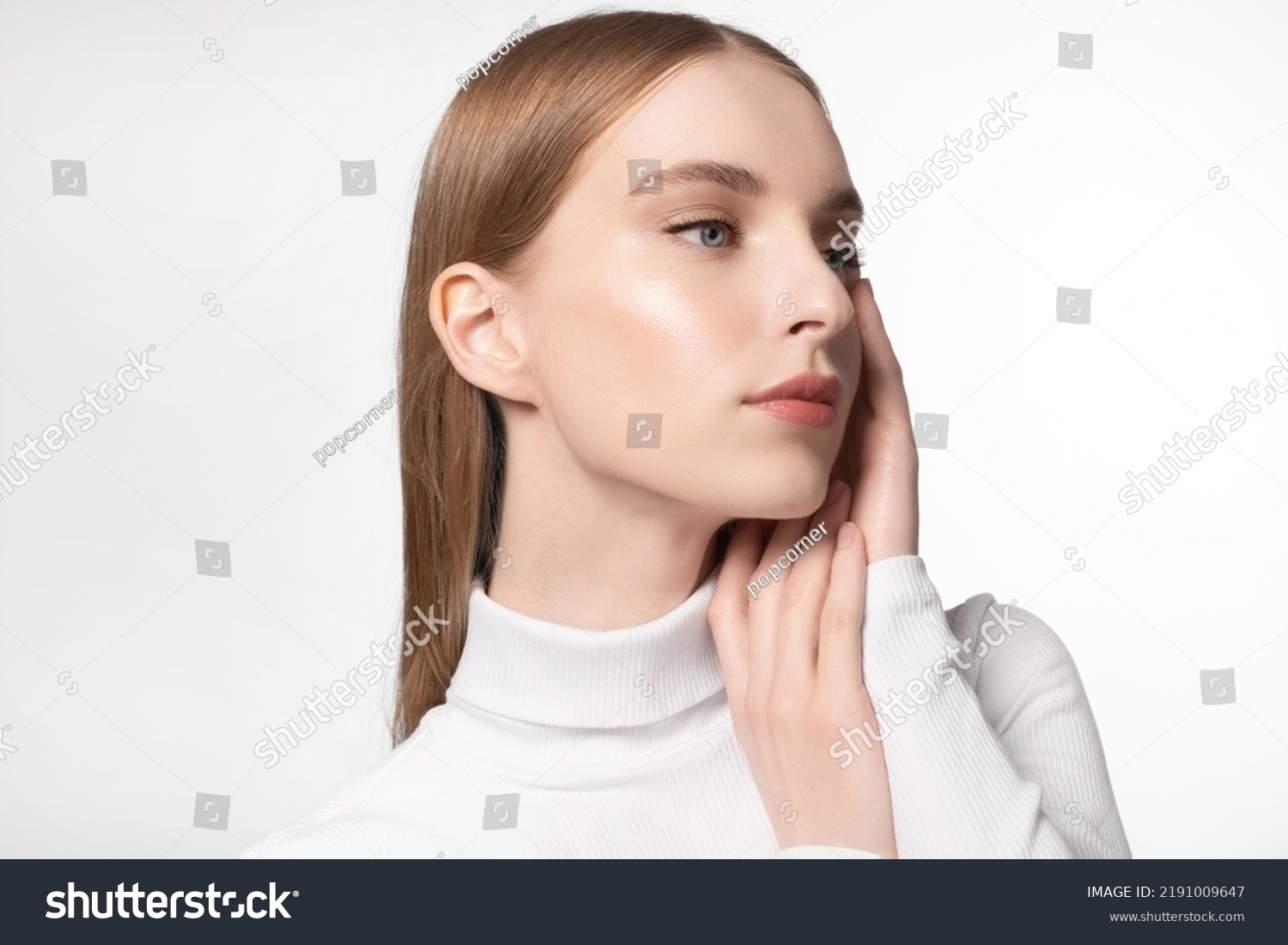 Beautiful girl touching her smooth soft facial skin. Model with natural ...