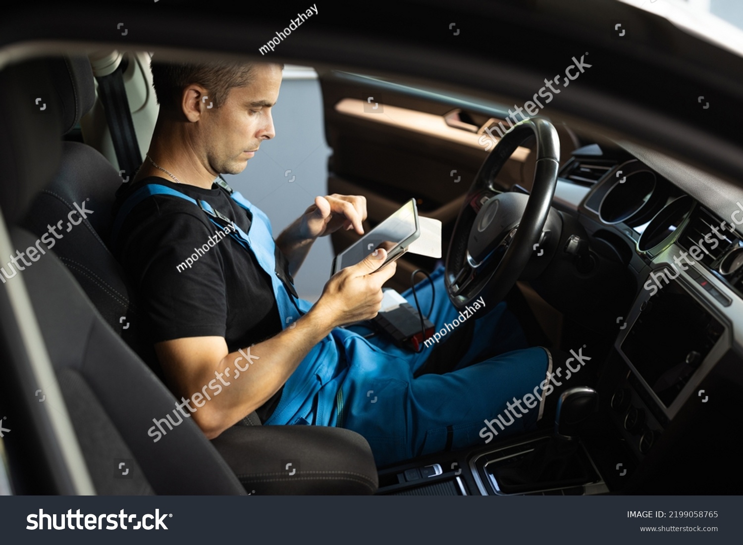 Using digital tablet for car diagnostic. Interactive diagnostics ...