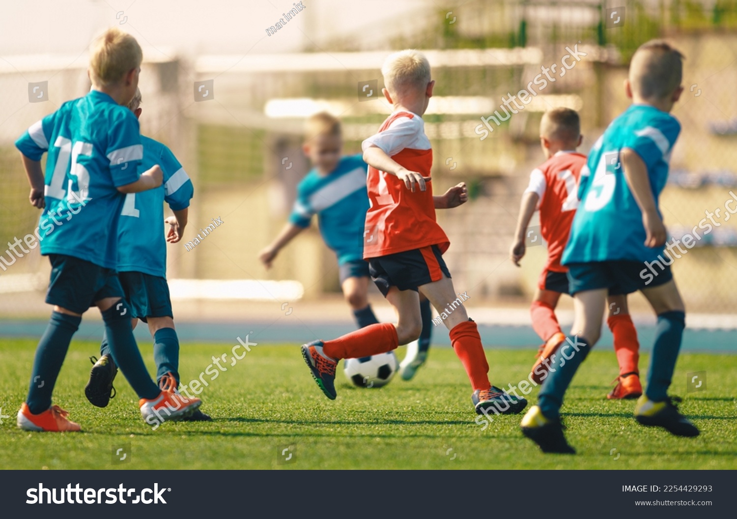 Football Soccer Game Between Kids. School Kids Play Football Match in ...